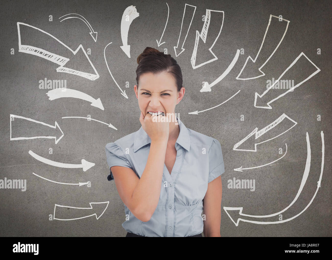 Angry businesswoman biting her fist Stock Photo - Alamy