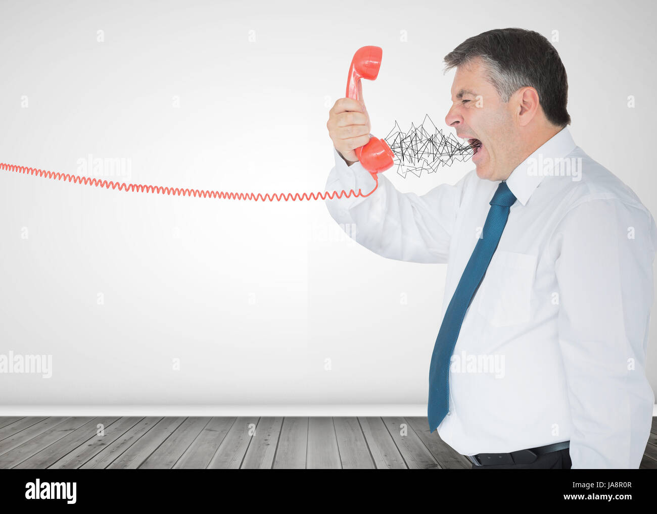 Mature businessman screaming on the phone in an empty room Stock Photo ...