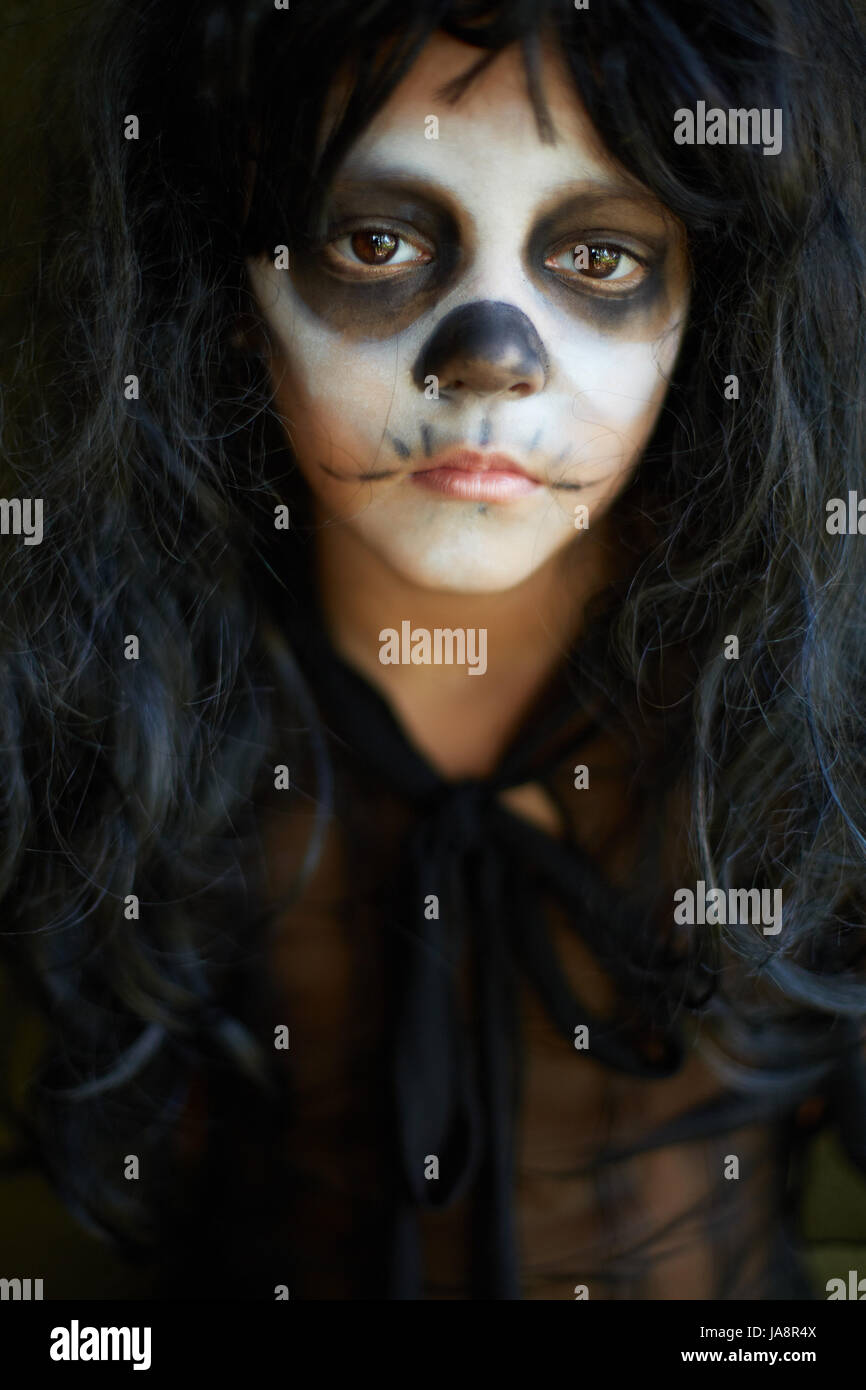 Portrait of spooky girl in Halloween attire looking at camera Stock ...