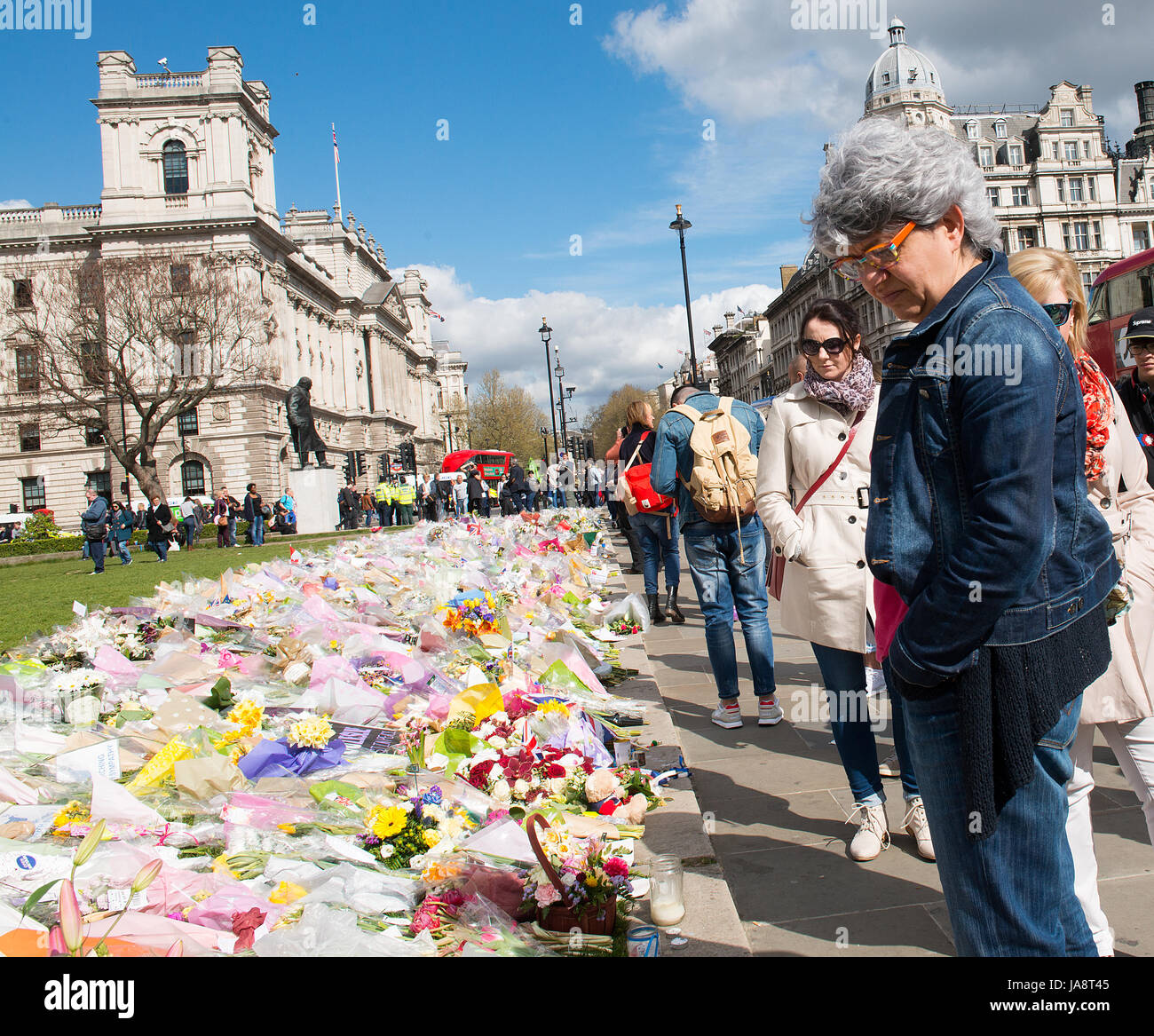 Floral tributes outside Parliament Square, to the victims of the ...