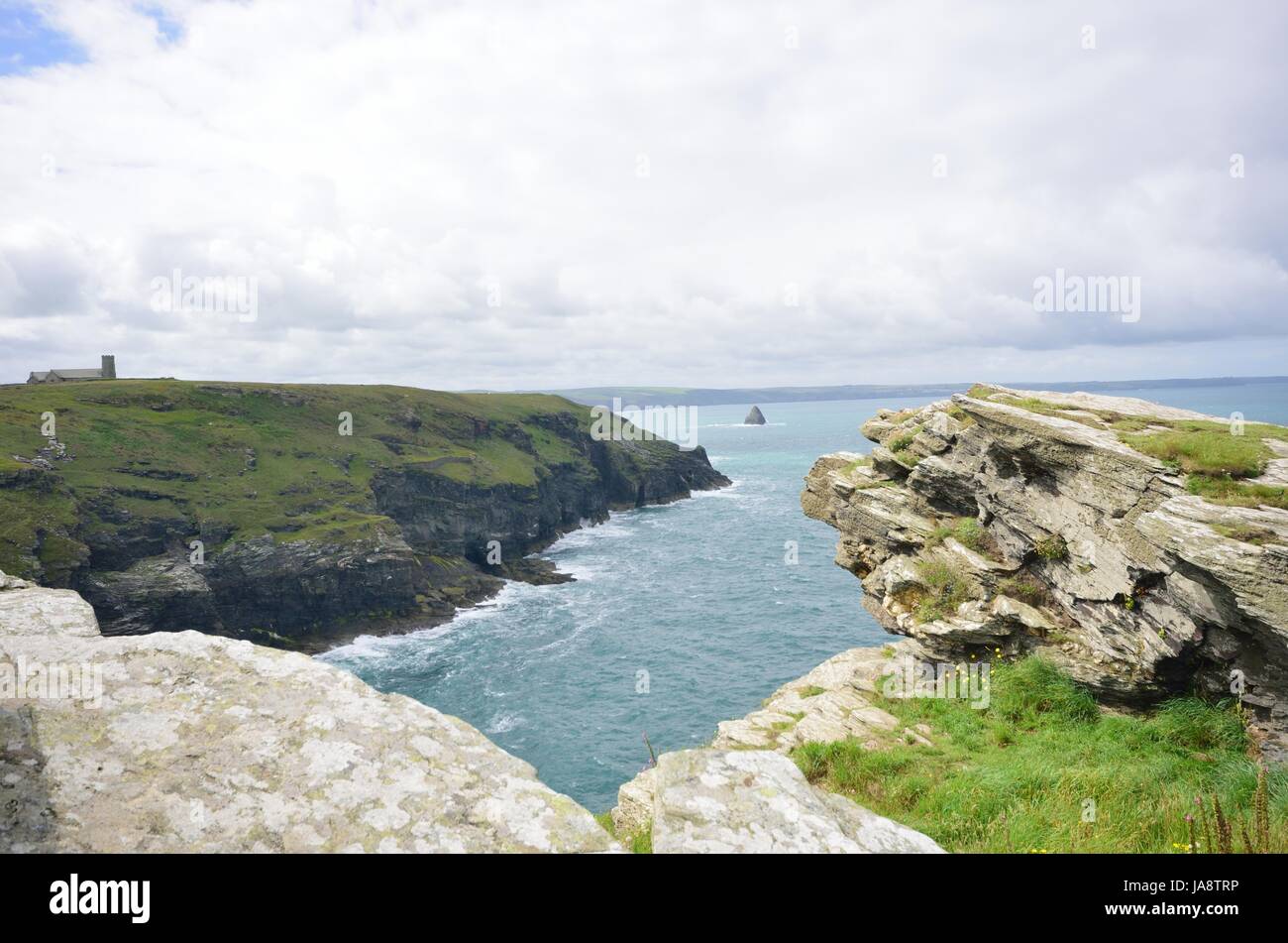 Cornish coastline in UK with rock in foreground Stock Photo - Alamy
