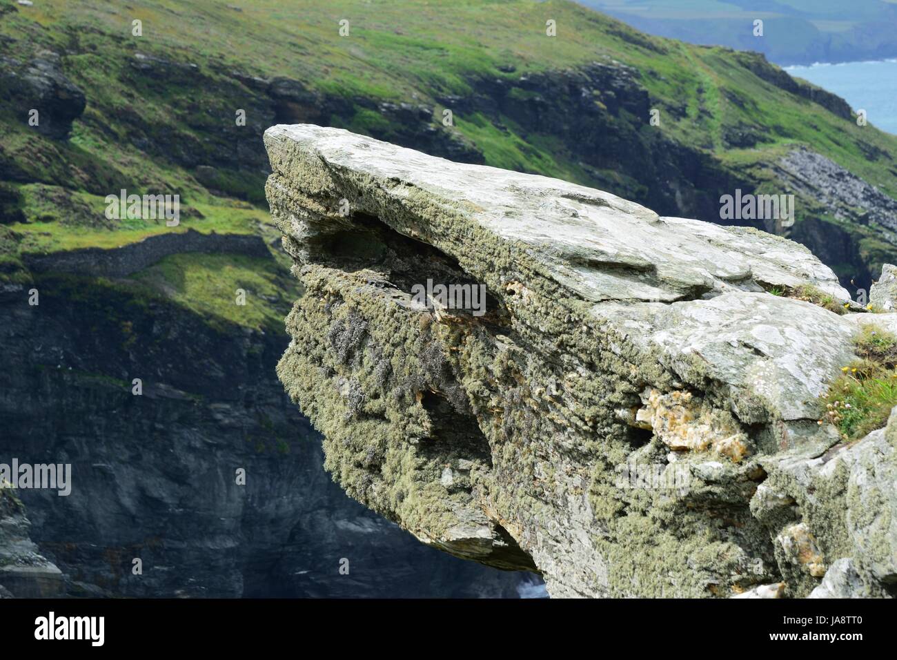 Rock jutting out of the sea hi-res stock photography and images - Alamy