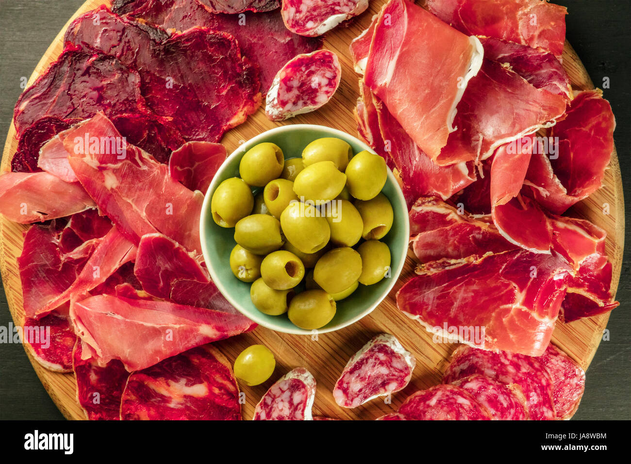 Overhead photo of Spanish cold meats platter with olives Stock Photo ...