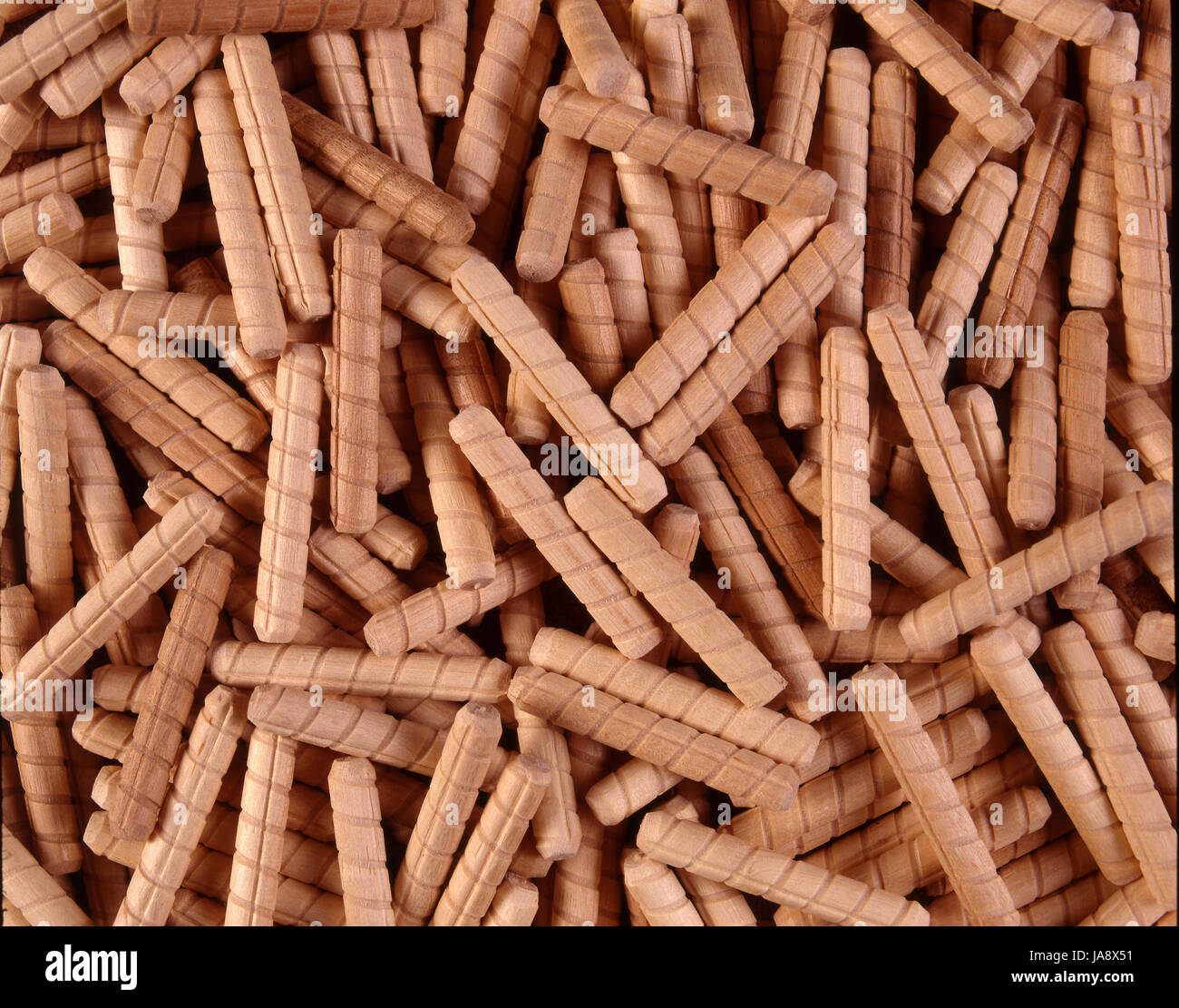 This is a close-up view of small wooden dowels that are used in ...