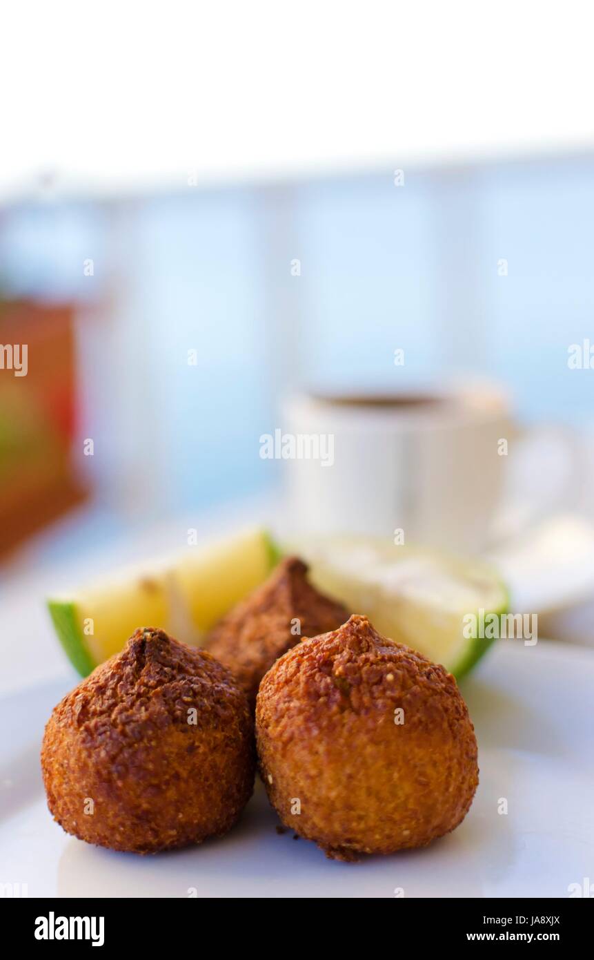 Three small pieces of kebbe, a lebanese dish with mince meat or ...