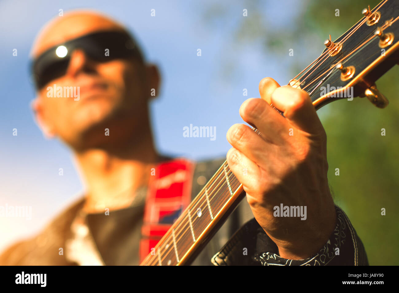 Acoustic guitar handle with hand making arrangement with the blur ...