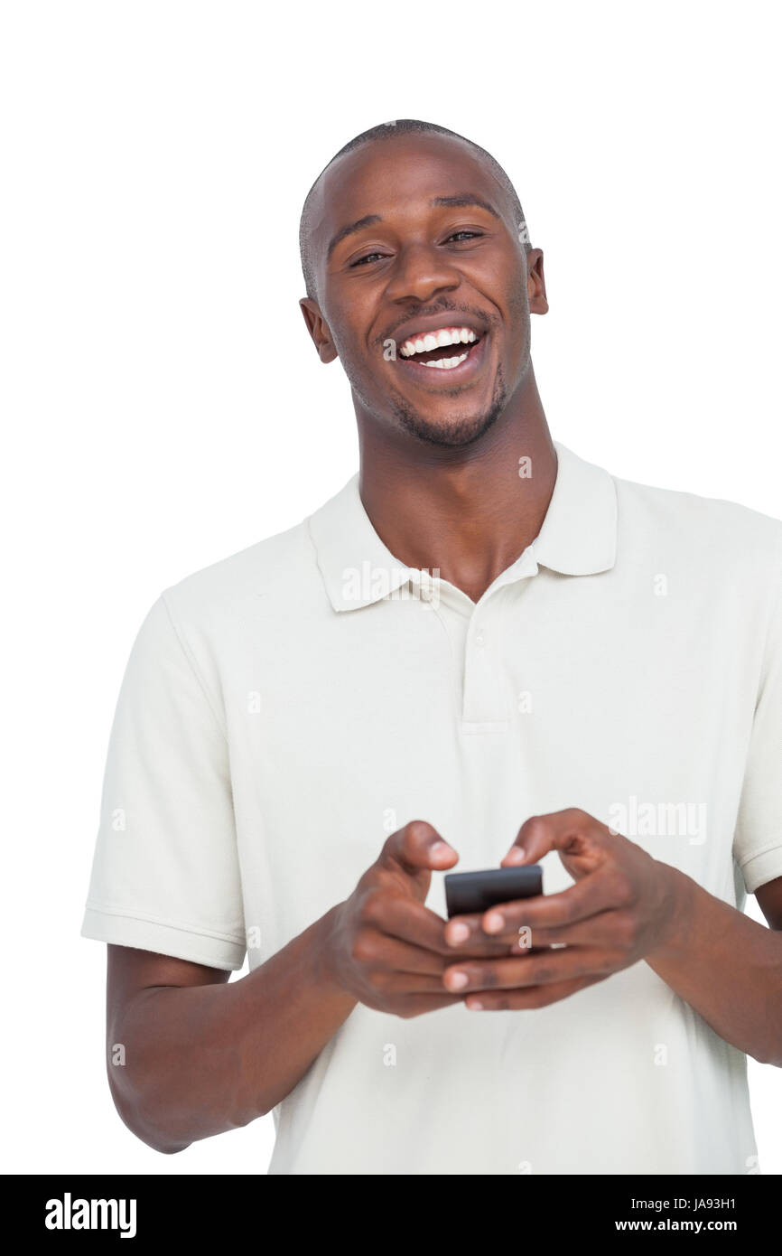 Laughing man with mobile phone on a white background Stock Photo - Alamy
