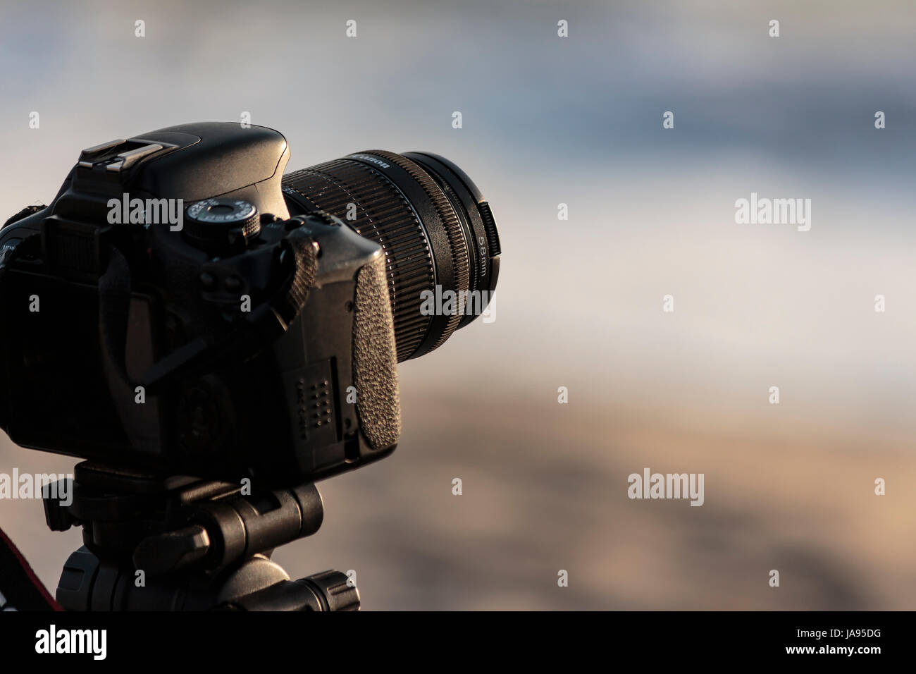 Camera on a tripod to take pictures of the sea Stock Photo - Alamy