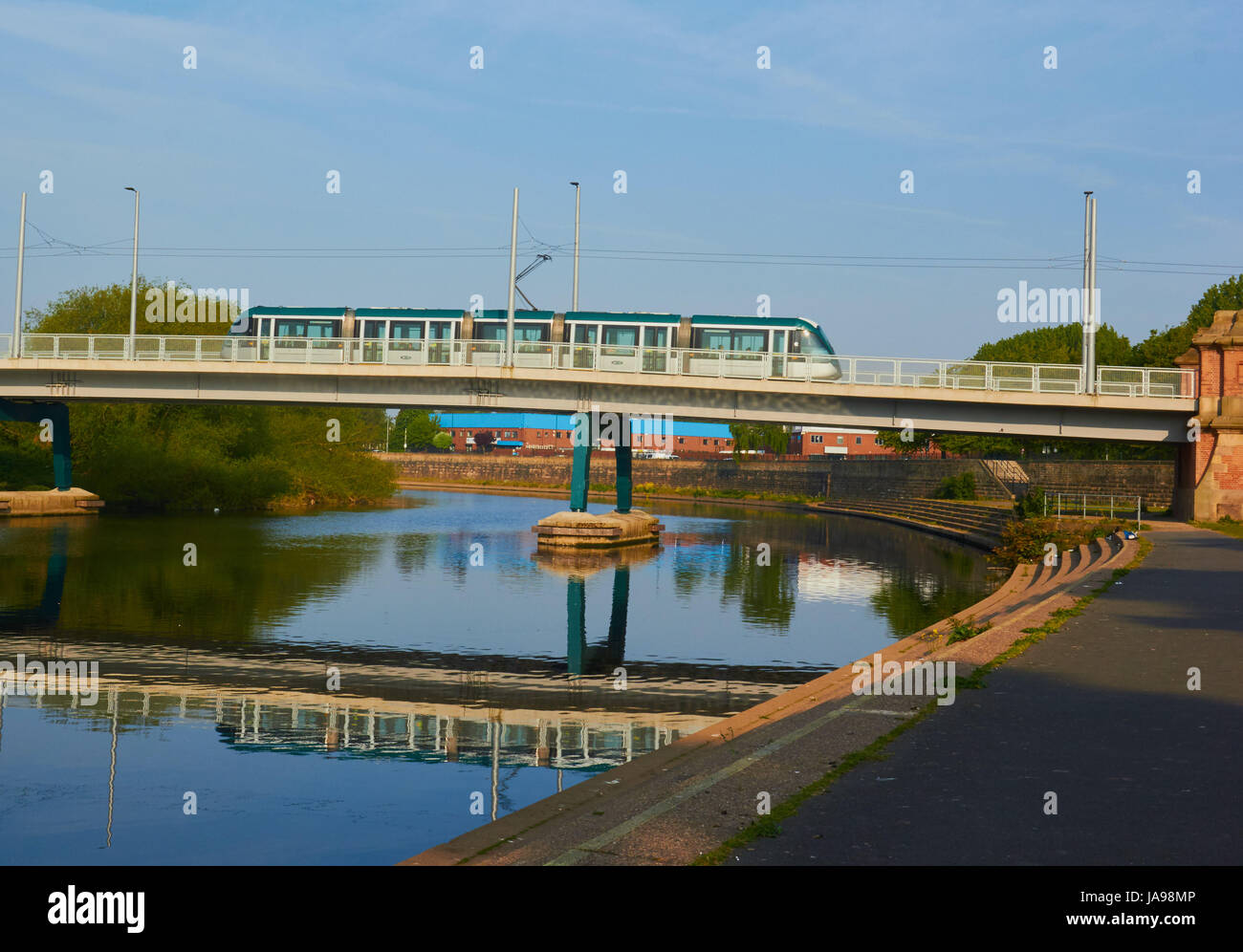 Tram crossing Wilford Toll Bridge over the river Trent, Nottingham ...