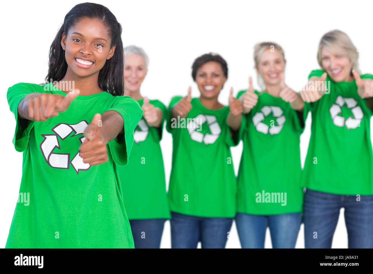 Team of environmental activists smiling at camera with hands together ...