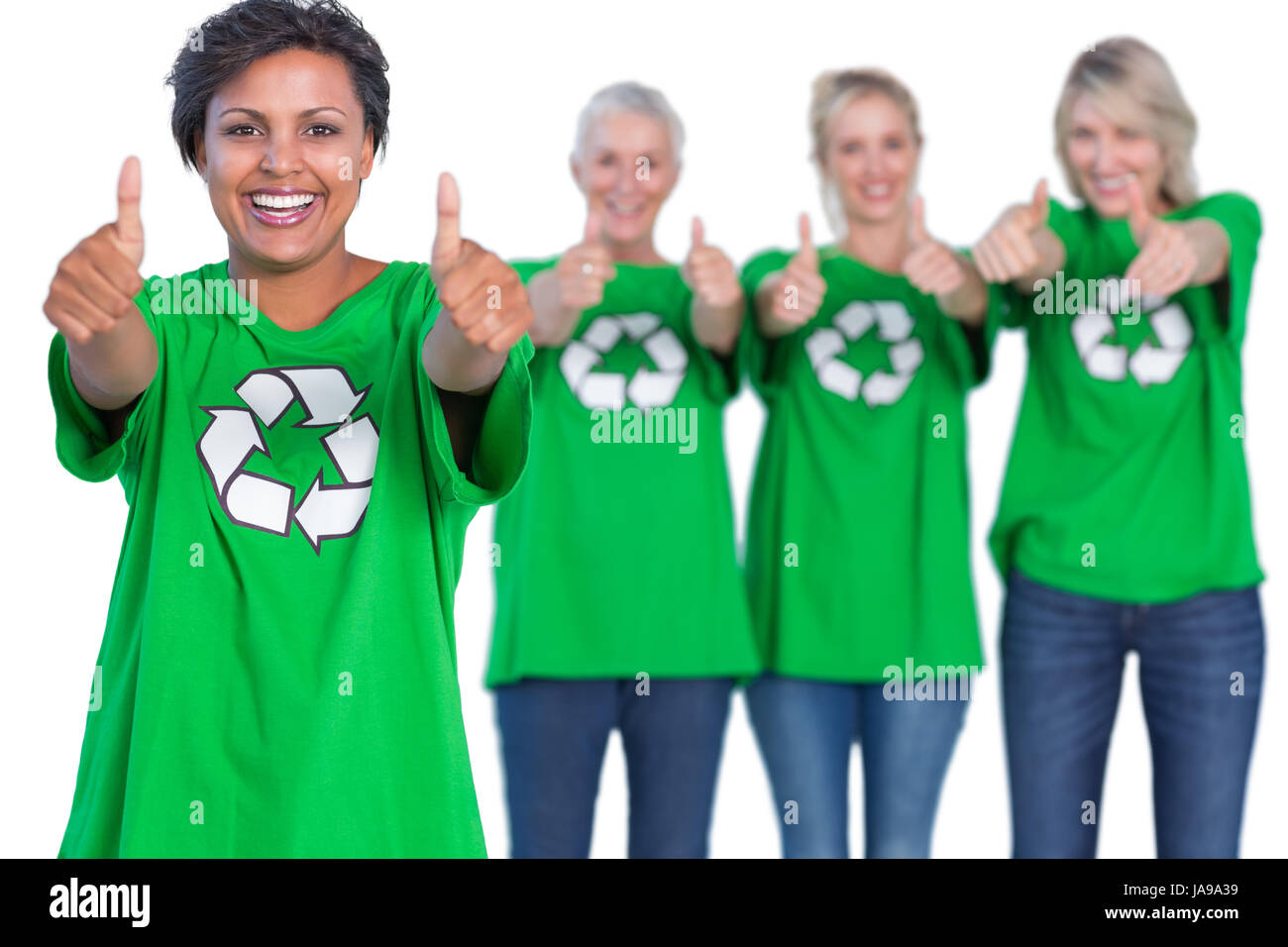 Happy women wearing green recycling tshirts giving thumbs up on white ...