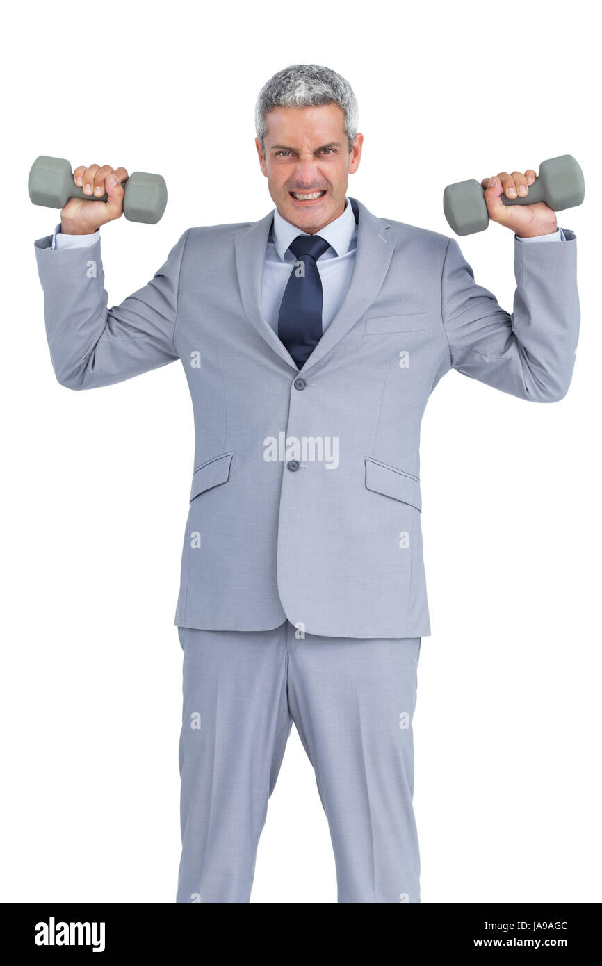 Strong businessman lifting dumbbells on white background Stock Photo ...