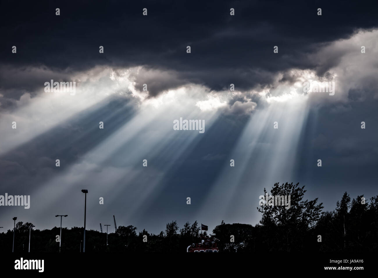 Sun through the storm clouds hi-res stock photography and images - Alamy