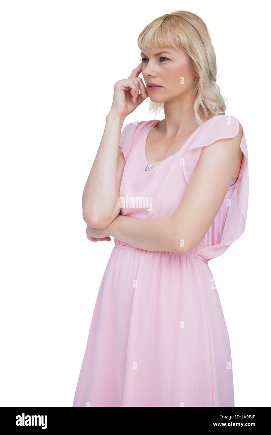 Thoughtful blonde woman touching her forehead against white background ...
