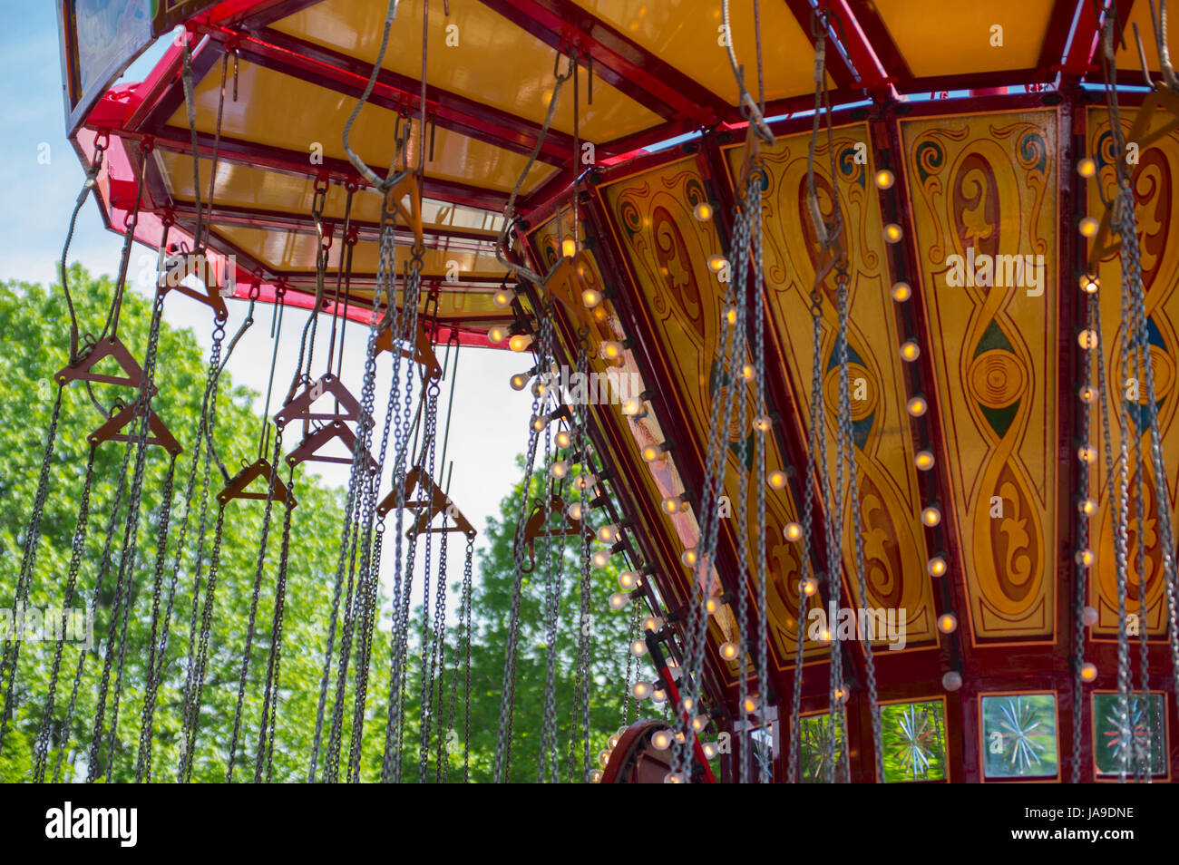 Chain swing carousel ride roof detail Stock Photo - Alamy