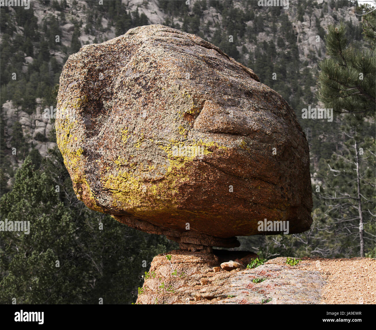 Crazy boulder balancing on a small stand Stock Photo - Alamy