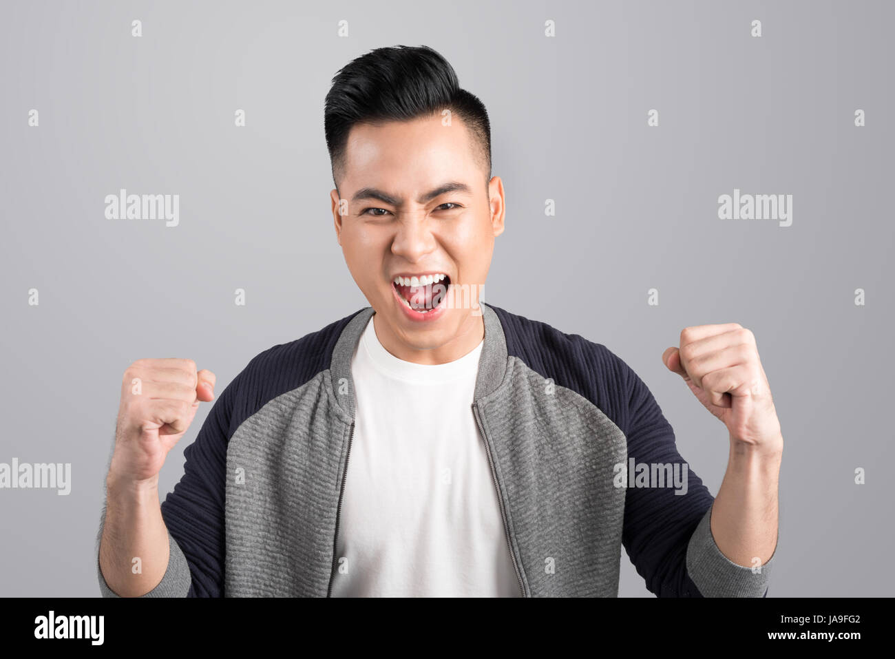 Portrait excited young businessman celebrating hi-res stock photography ...