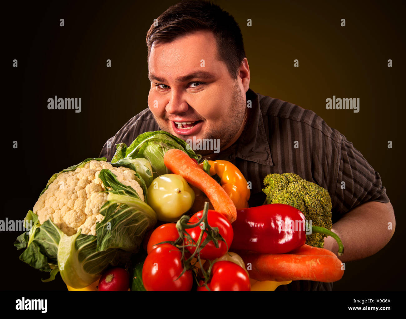 Diet fat man eating healthy food . Healthy breakfast with vegetables ...