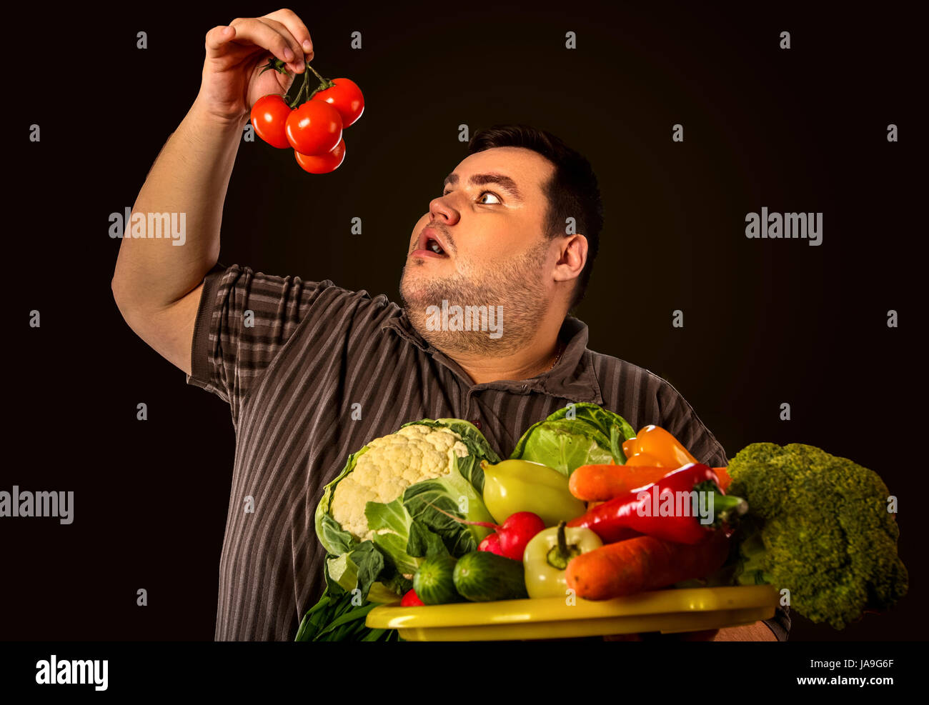 Diet fat man eating healthy food . Healthy breakfast with vegetables ...