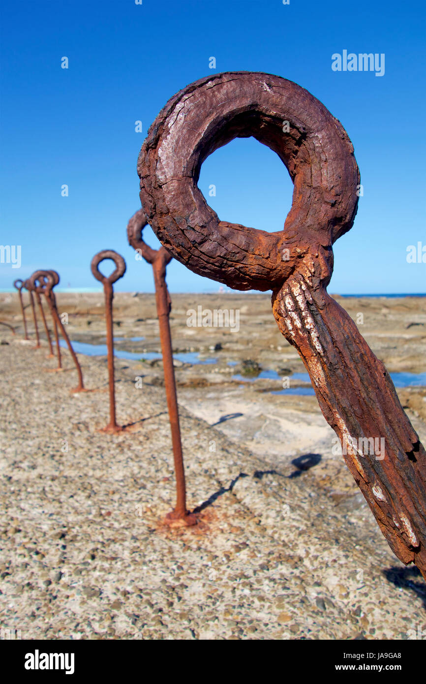 Old rusty bollards at Newcastle beach, Australia Stock Photo - Alamy
