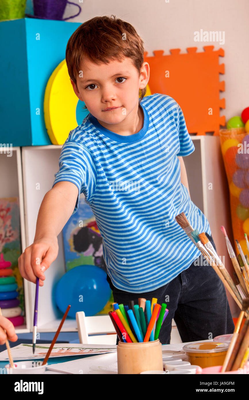 Small students boy painting in art school class Stock Photo - Alamy