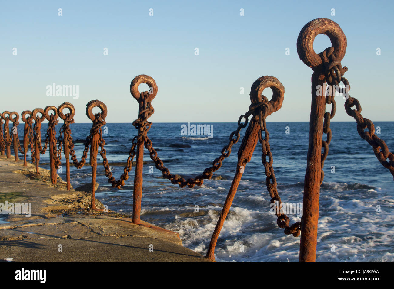 Old rusty bollards at Newcastle beach, Australia Stock Photo - Alamy