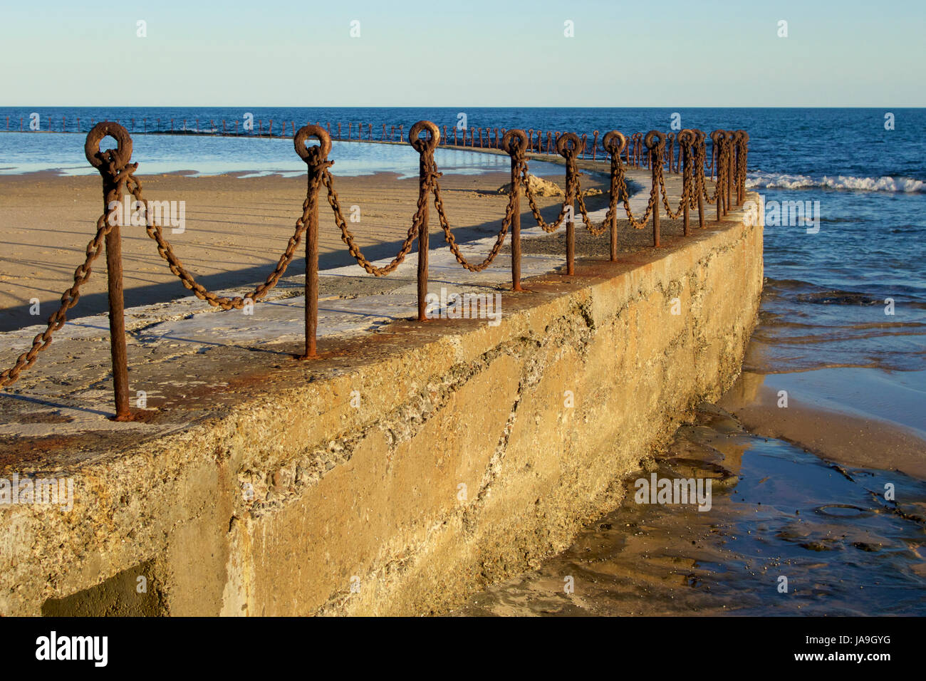 Old rusty bollards at Newcastle beach, Australia Stock Photo - Alamy