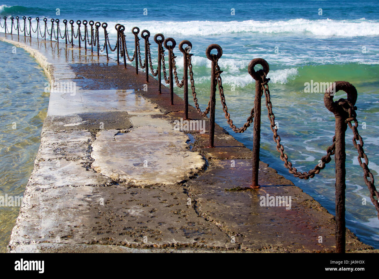 Old rusty bollards at Newcastle beach, Australia Stock Photo - Alamy