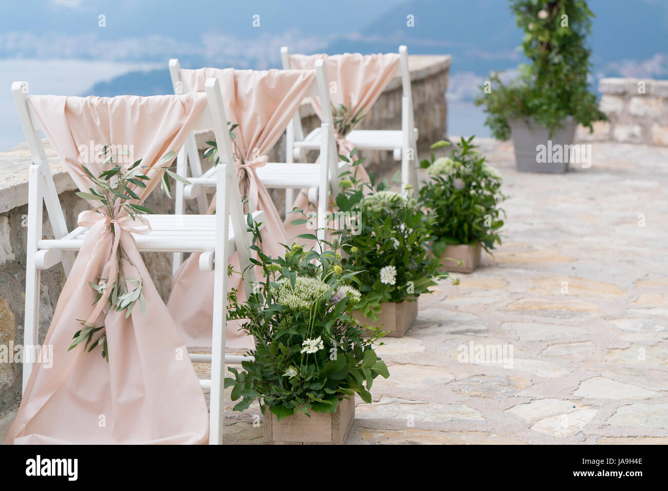 decorated chairs at the wedding venue Stock Photo - Alamy