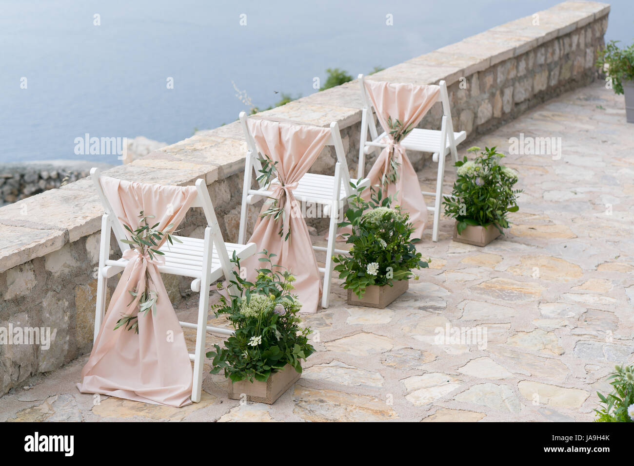 decorated chairs at the wedding venue Stock Photo - Alamy