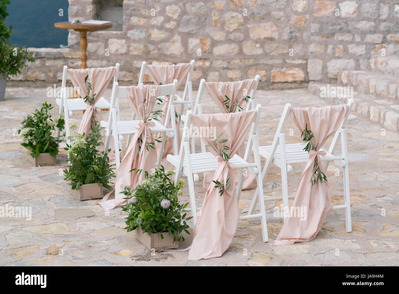decorated chairs at the wedding venue Stock Photo - Alamy