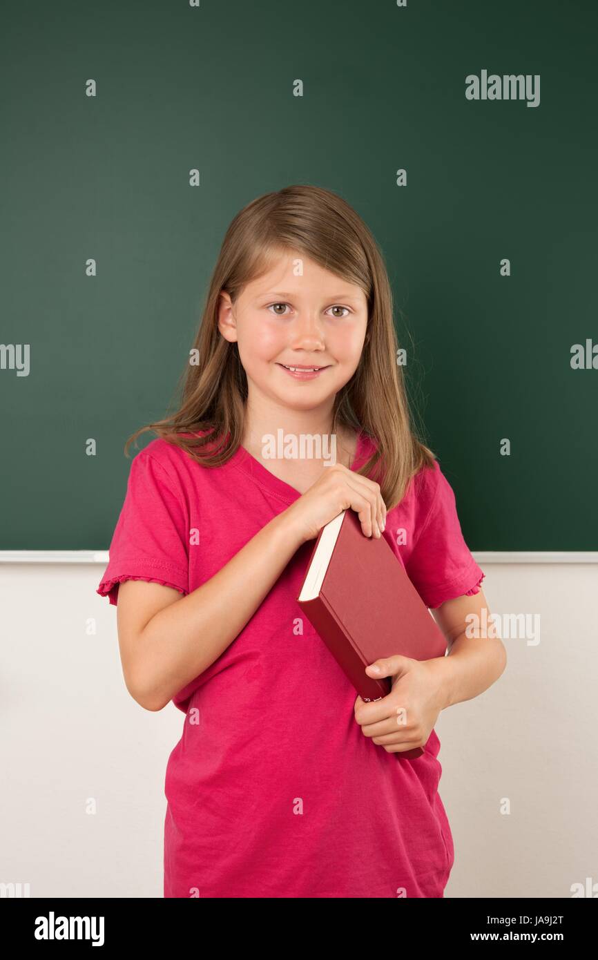 student standing in front of a blackboard Stock Photo - Alamy