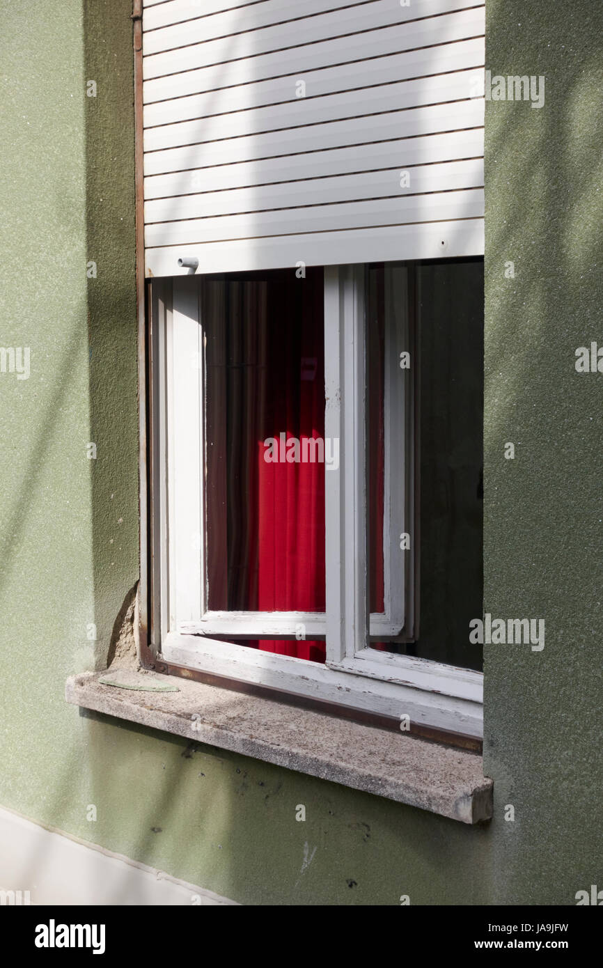 Window partially opened with a red curtain. View from outside Stock ...
