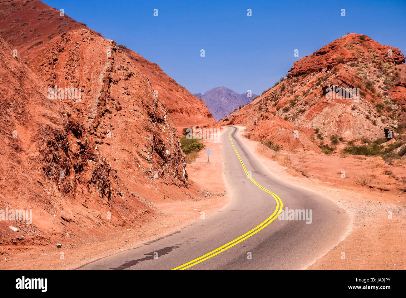 Road through colourful polychromic mountains in Northern Argentina ...
