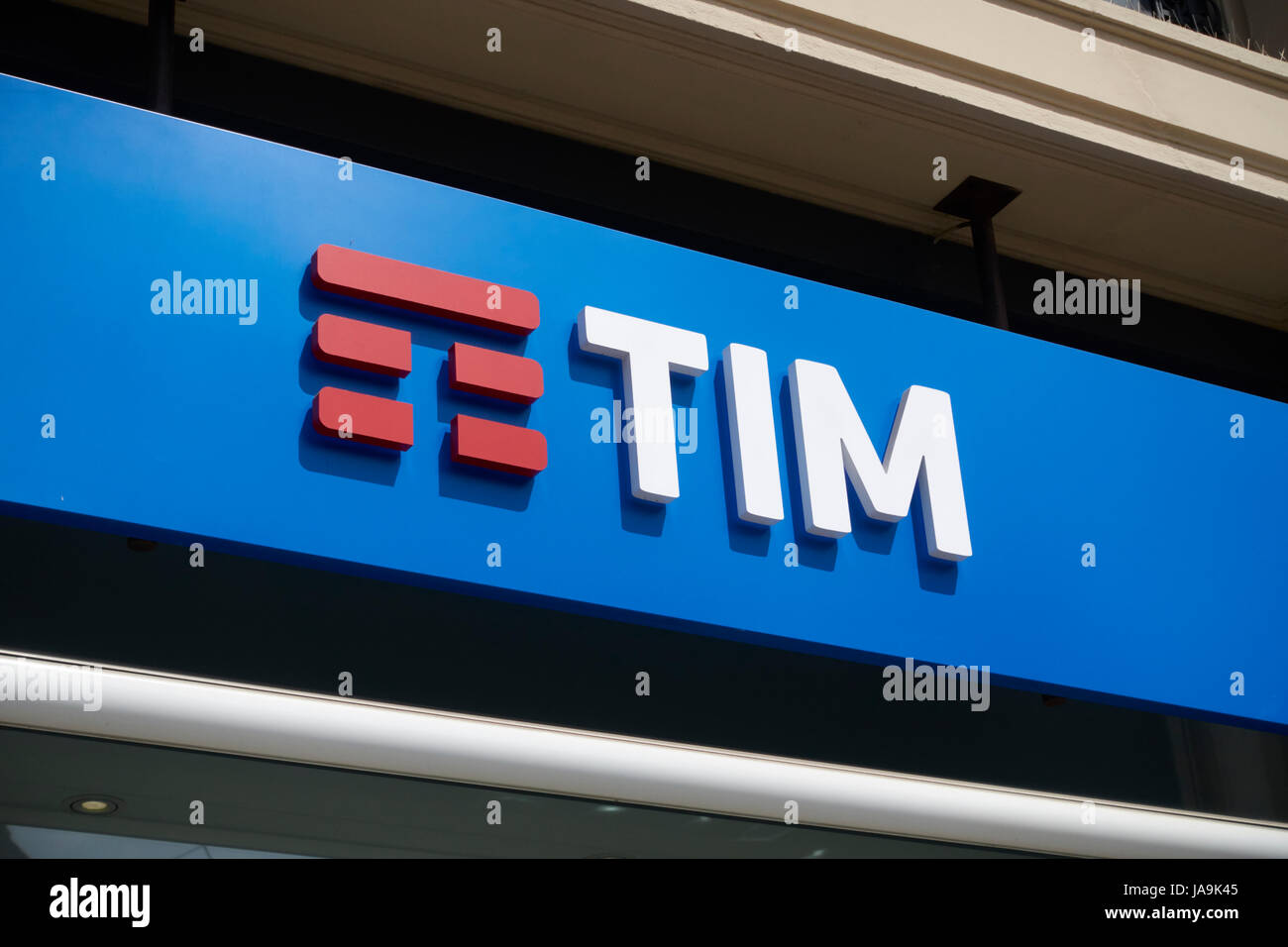 TIM, Telecon Italia Mobile company brand logo in the facade of a store ...