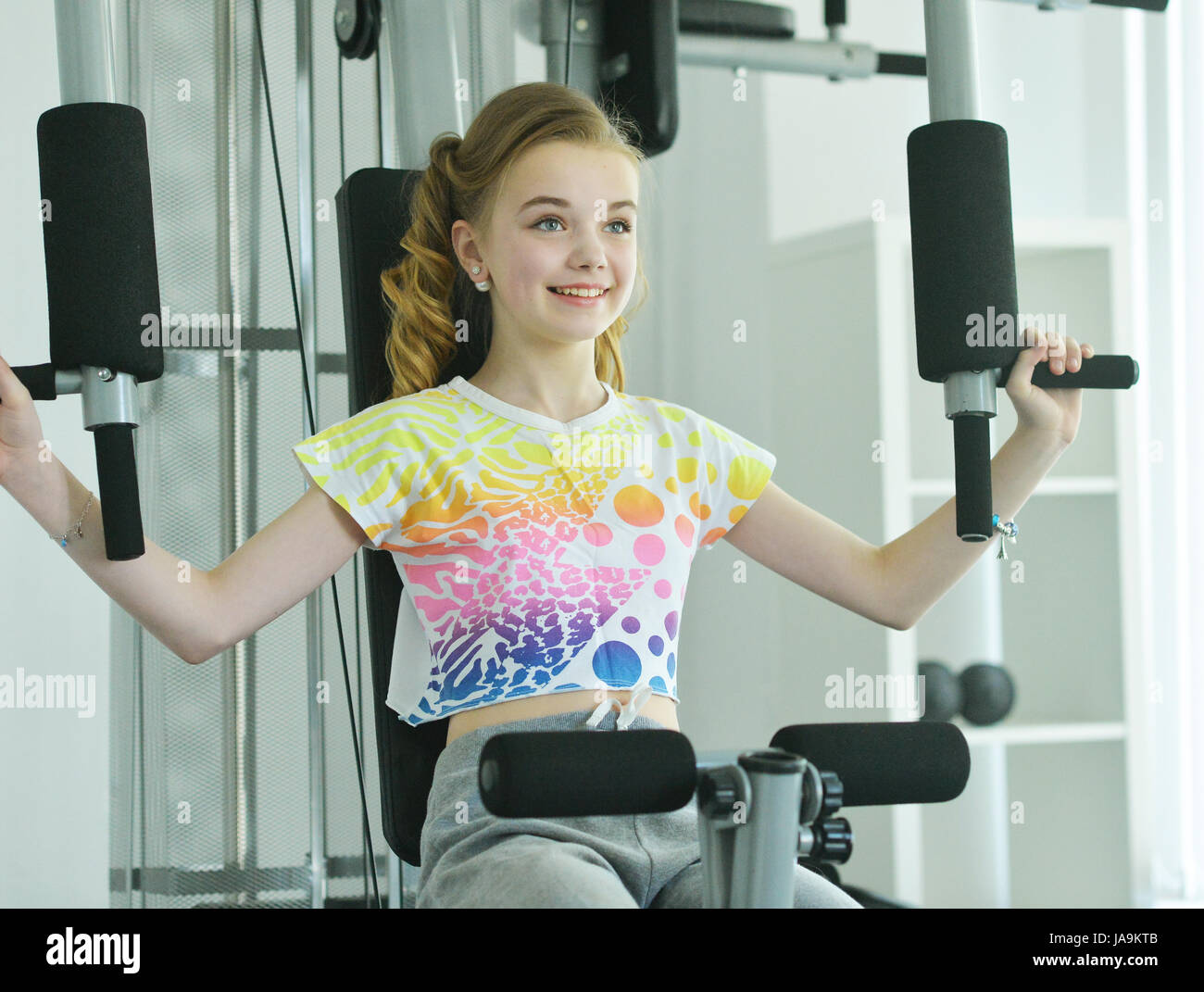 Cute little girl doing exercises Stock Photo - Alamy