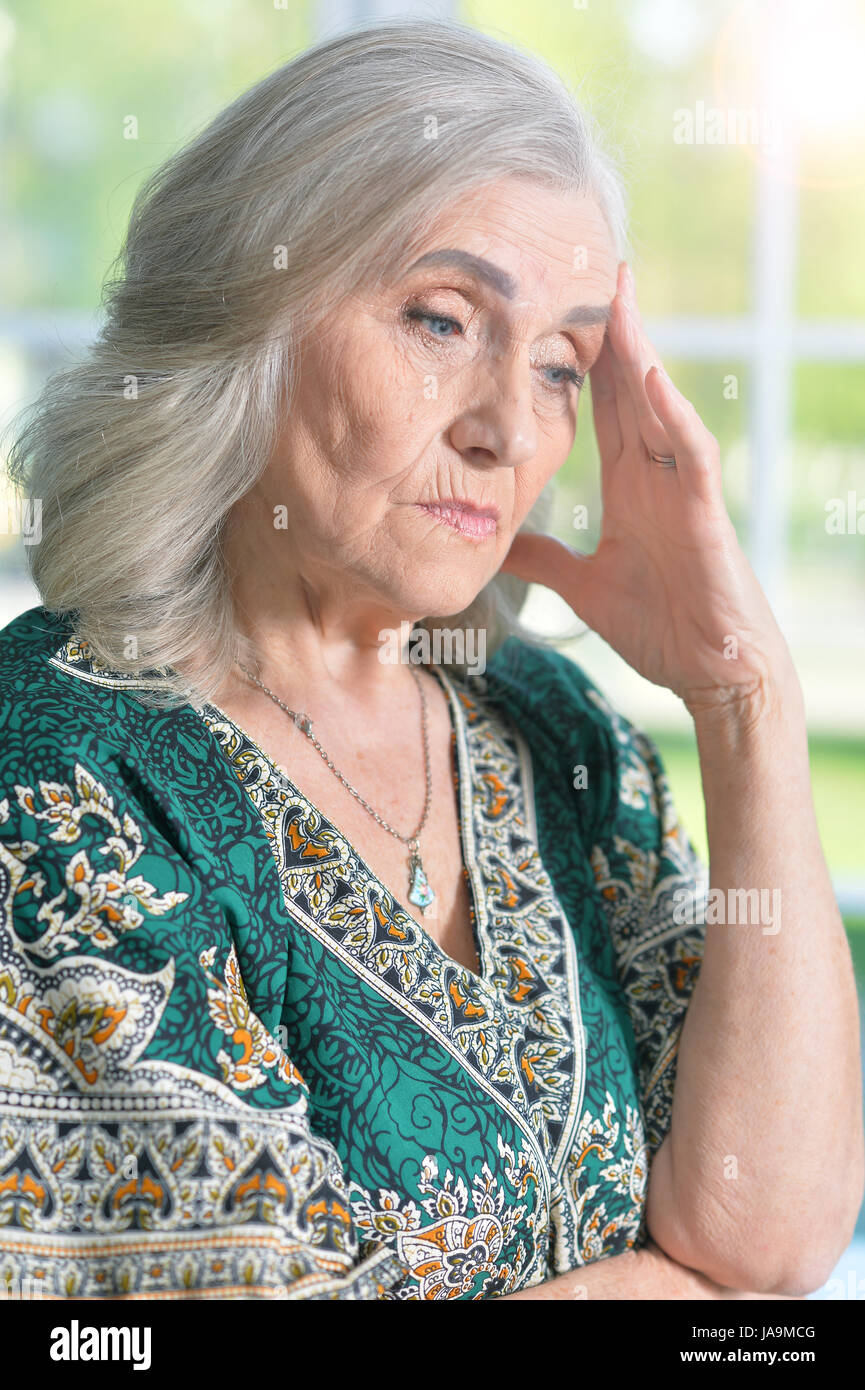 Sad senior woman Stock Photo - Alamy