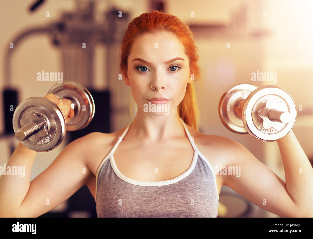 Young woman training in gym Stock Photo - Alamy