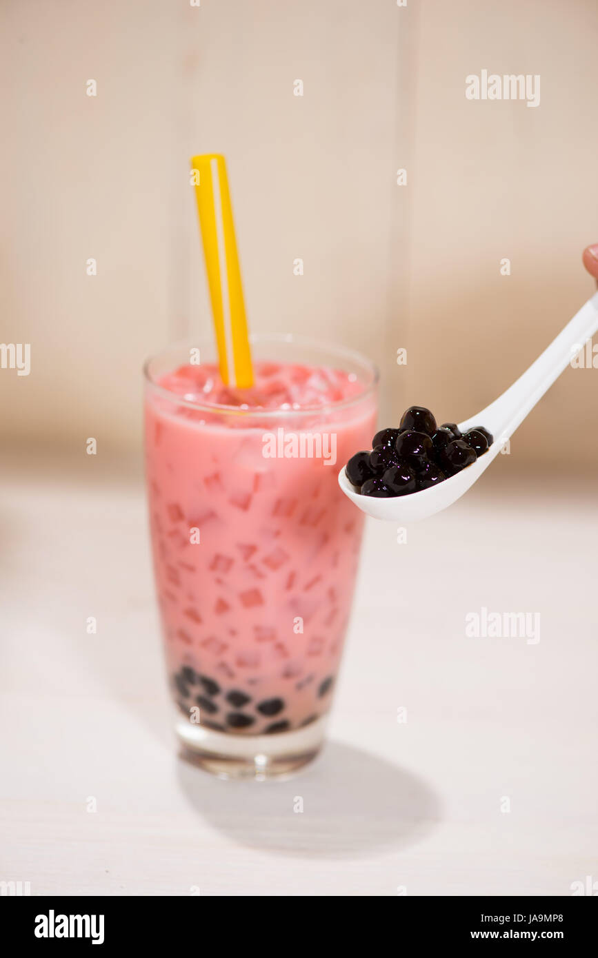 Boba / Bubble tea. Homemade Strawberry Milk Tea with Pearls on wooden ...