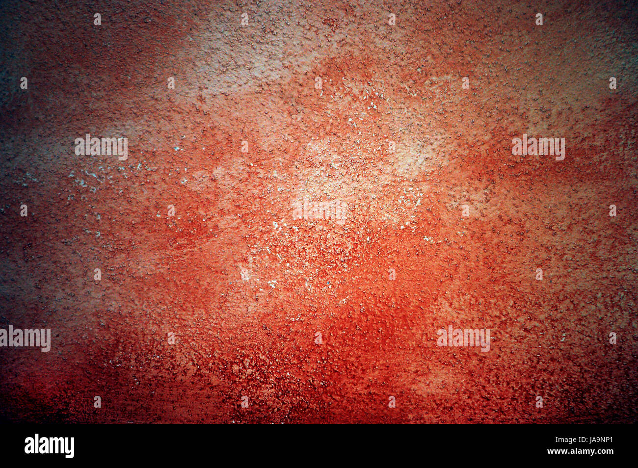 red gritty wall as background Stock Photo - Alamy