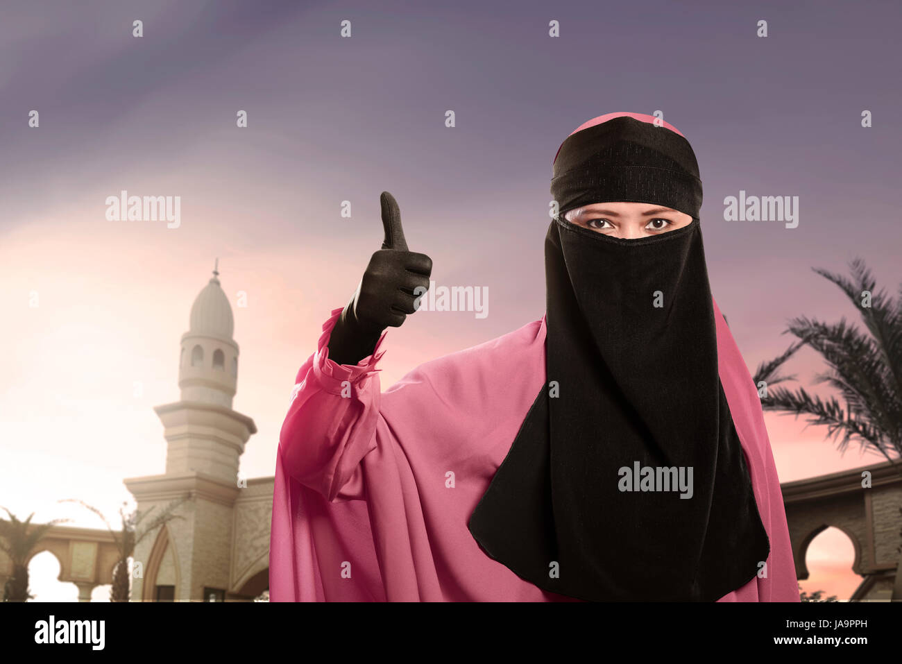 Beautiful asian muslim woman wearing niqab with happy expression during ...