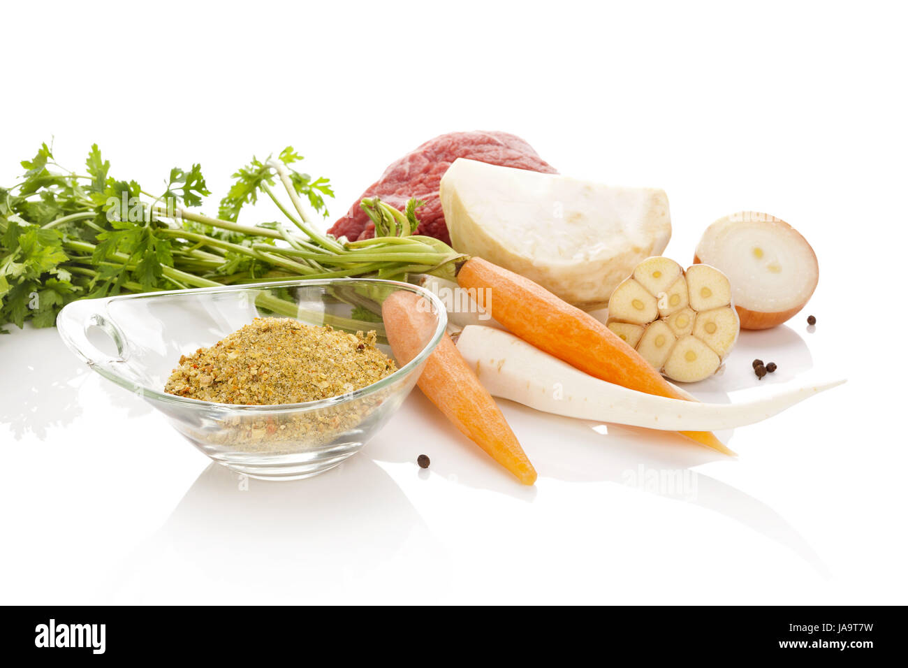 Vegetables with meat and vegeta condiment isolated on white background ...