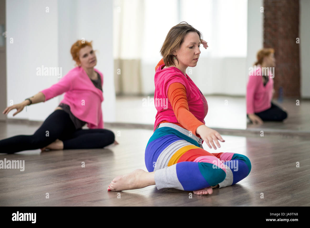 Two women dancing dance contact improvisation Stock Photo - Alamy