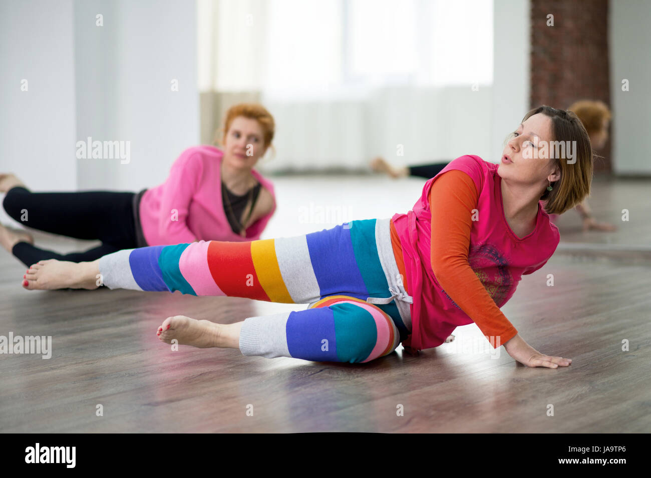 Two women dancing dance contact improvisation Stock Photo - Alamy
