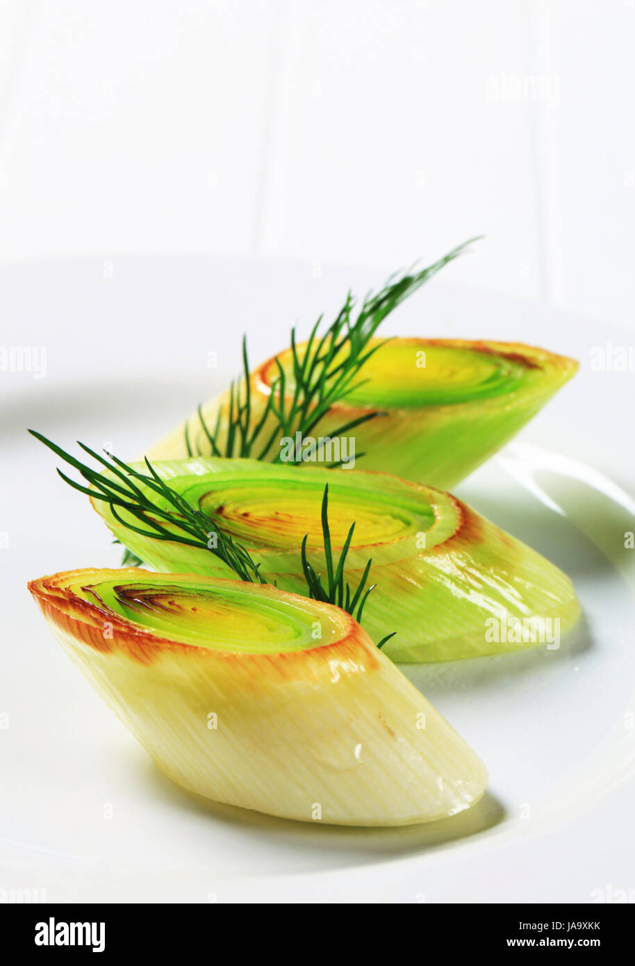 Pan fried pieces of leek Stock Photo - Alamy