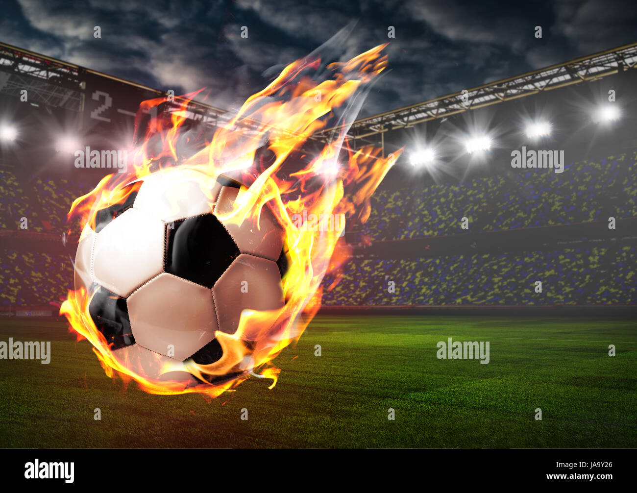Burning soccer ball on stadium Stock Photo - Alamy