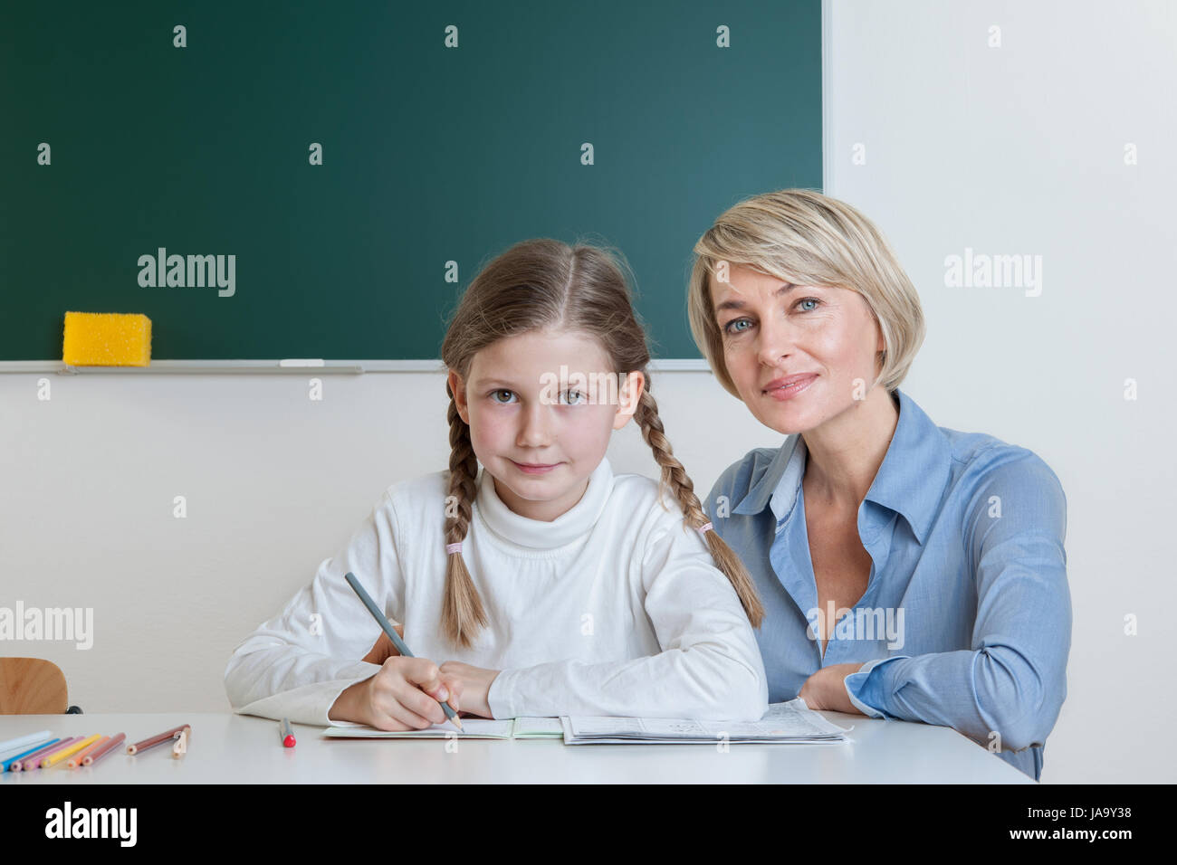 teacher and student in the classroom Stock Photo - Alamy