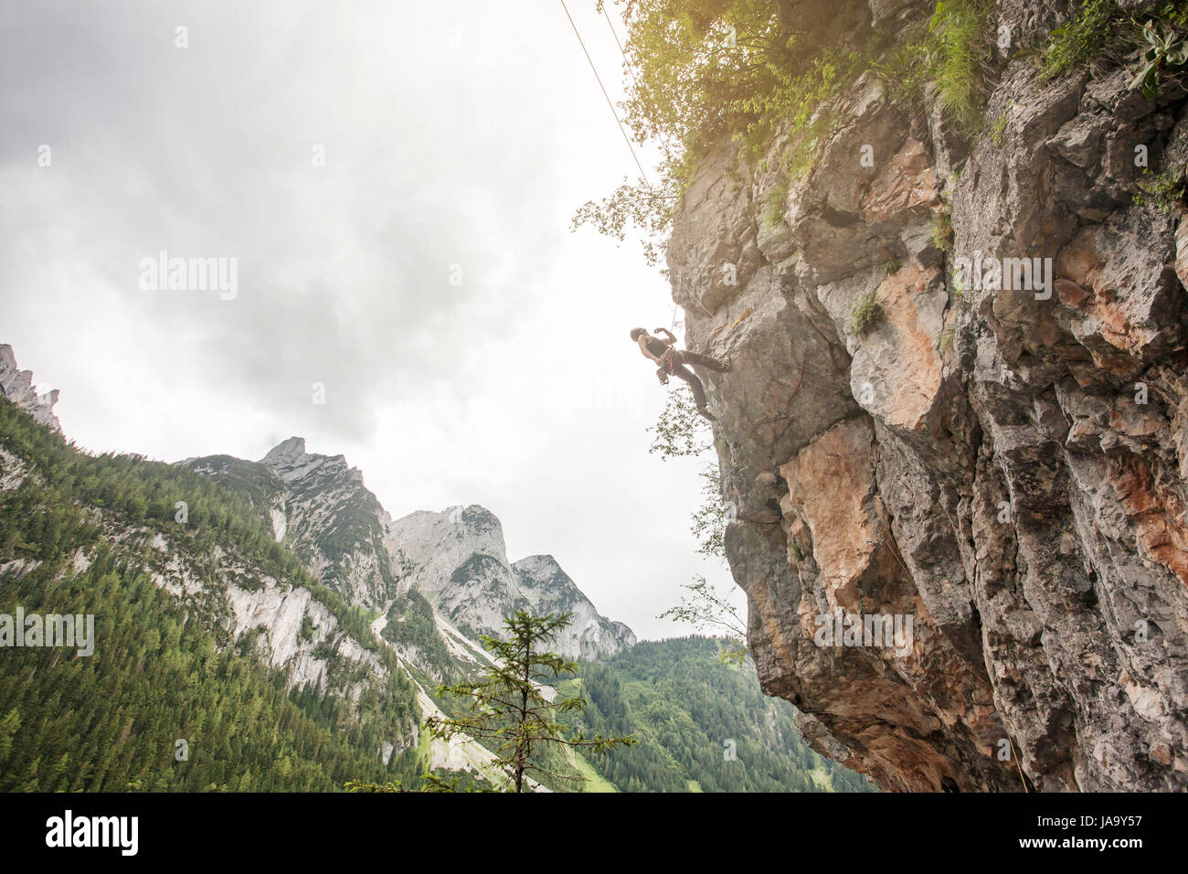 Landscape of Gosau Valley mountain with a male climber Stock Photo - Alamy