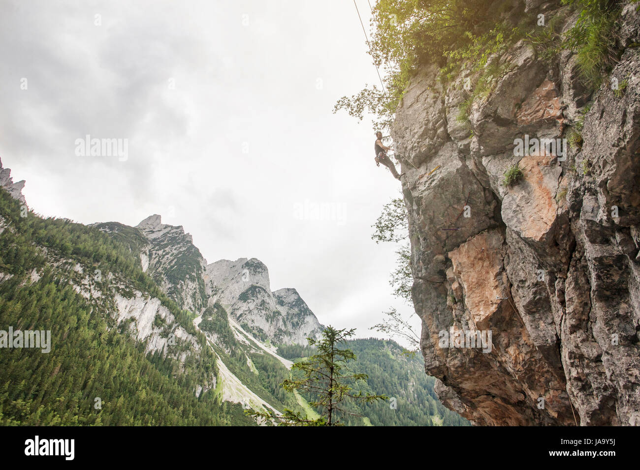 Landscape of Gosau Valley mountain with a male climber Stock Photo - Alamy