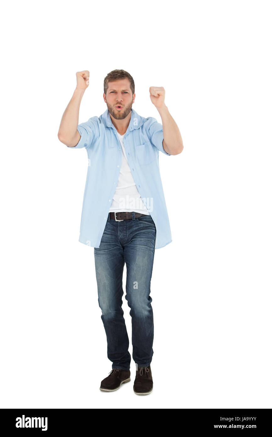 Cheerful casual man cheering on white background Stock Photo - Alamy